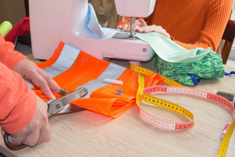 Tailor Cutting Fabric Using Large Scissors or Shears As he Follows the ...