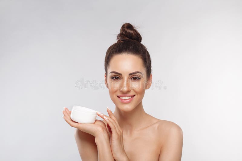 Hands Of A Woman About To Apply Face Cream Holding Moisturizing Lotion