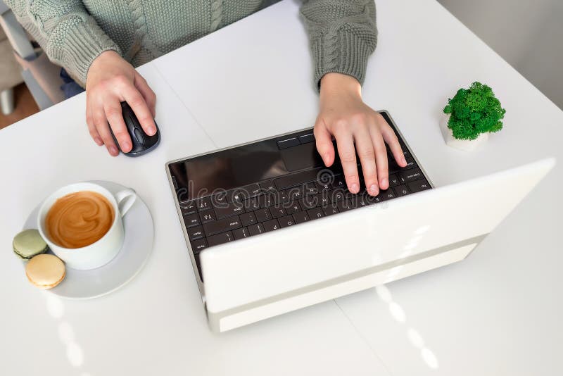 Hands of a Woman Working at a Computer, with a Cup of Coffee. Remote ...