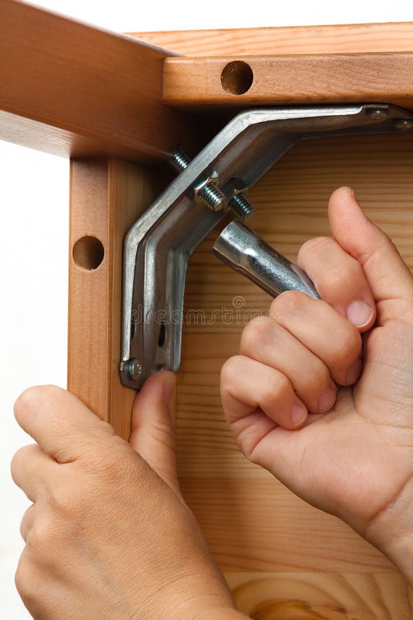 Hands of the Worker Assembling Wooden Table with Wrench Stock Image ...