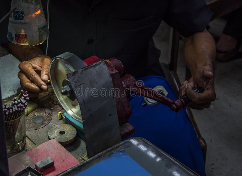 Worker Making Faceting of Semi-precious Stone on Grinding Machine in ...