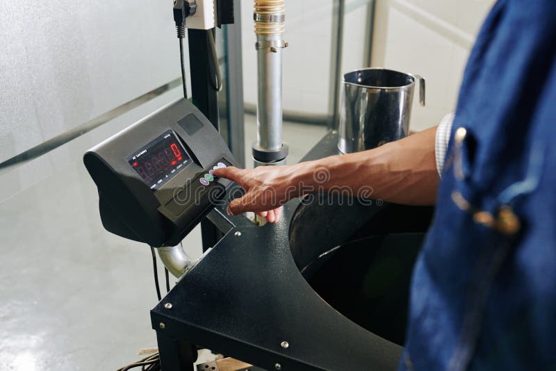 Turning on coffee roaster stock image. Image of setting - 193043157