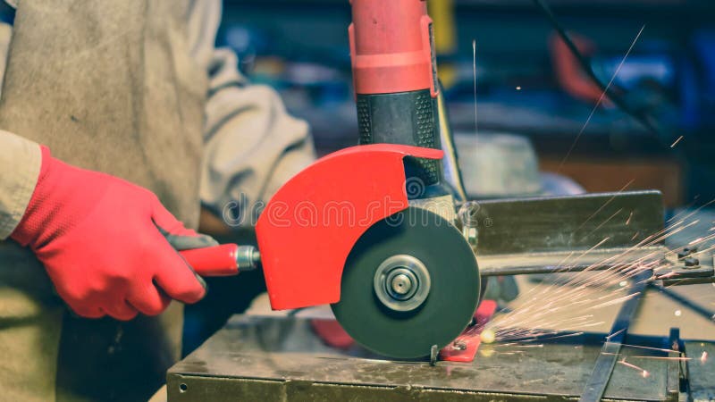 Hands of a Worker Wearing Gloves and Welding a Metallic Object in the ...