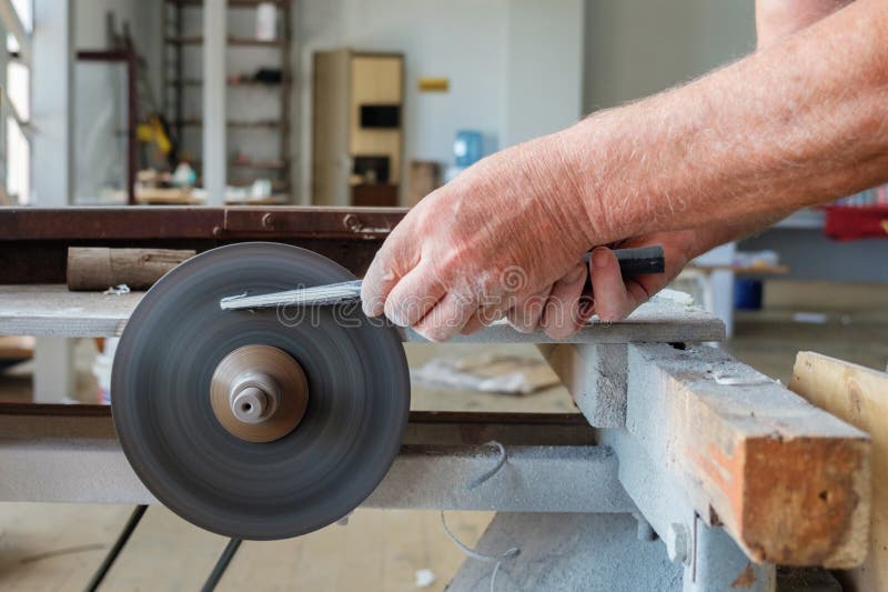 Hands of Worker Wich is Sharpering Knife on Grindstone Stock Photo ...