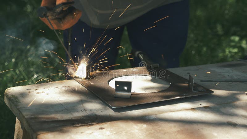 Hands Working with Metal Steel and Iron Using Welding Machine. Man ...