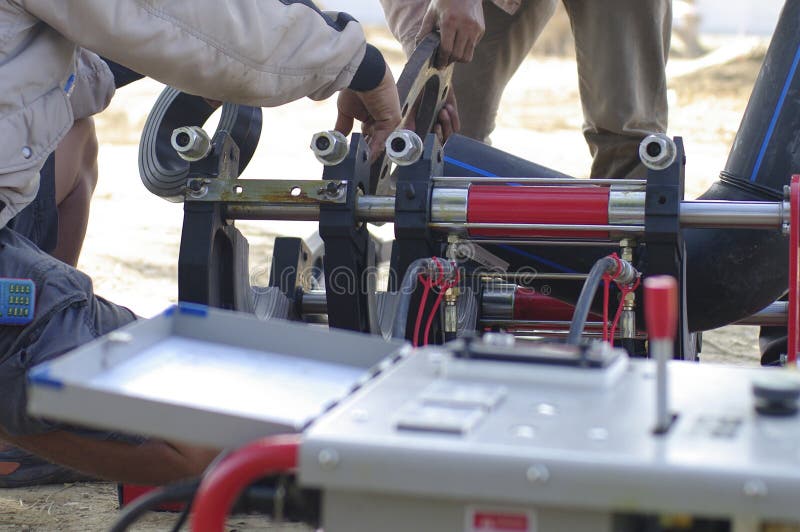 Hands Working on Pipe Joint Construction Machine Stock Image - Image of ...