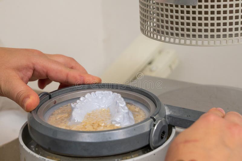 Hands Working with a Silicon Mold in a Controlled Lab for Research and ...
