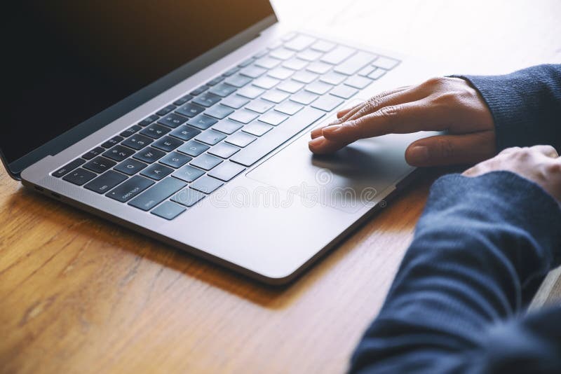 Hands Working and Touching on Laptop Touchpad on the Table Stock Image ...