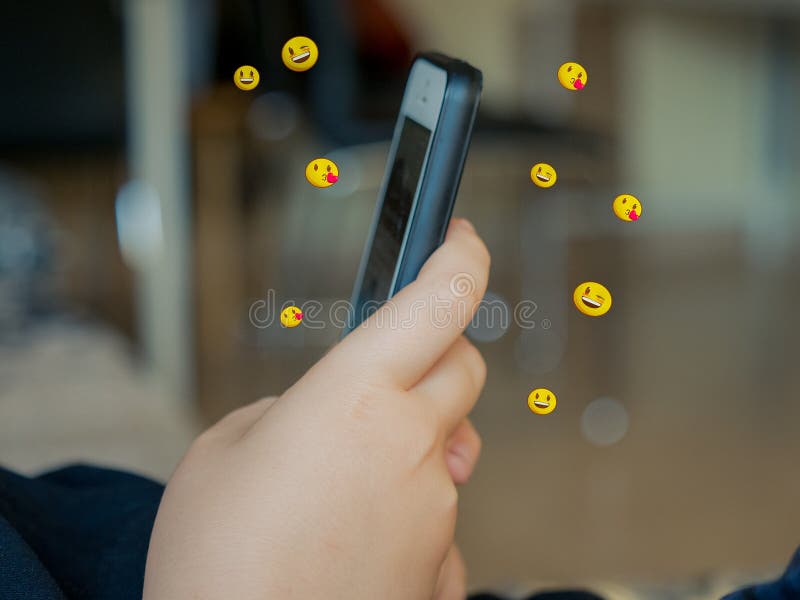 Hands Writing on a Cell Phone with Emoticons Stock Photo - Image of ...