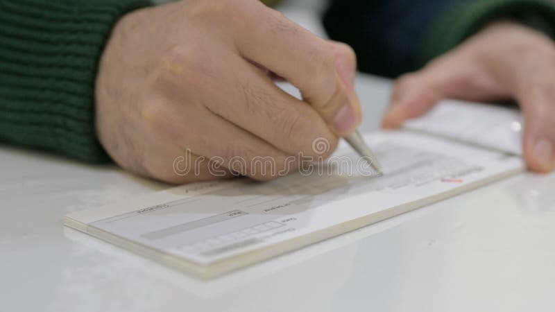 The Hands Writing on a Cheque in Bank Stock Footage - Video of paper ...