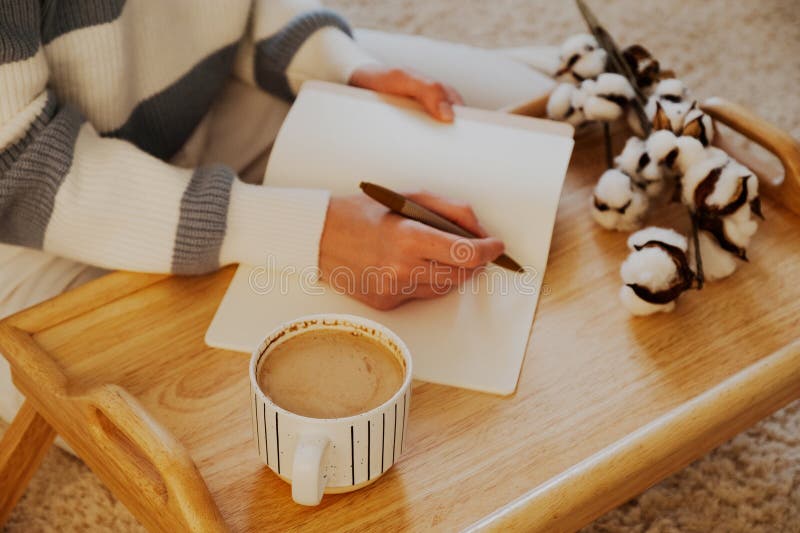 Hands Writing in a Notebook with a Cup of Coffee and Cotton Branches ...