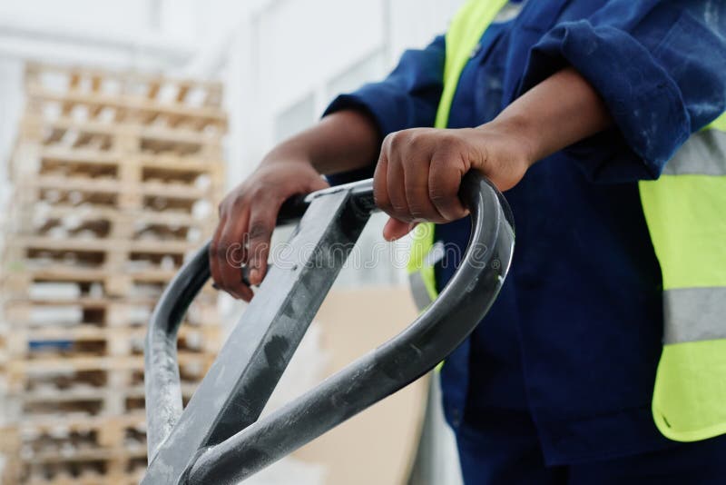 Hands of Young Black Woman in Uniform Holding by Handle of Forklift ...