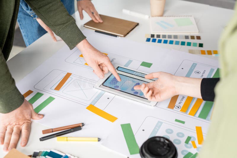 Hands of Young Contemporary Software Designers Pointing at Tablet ...