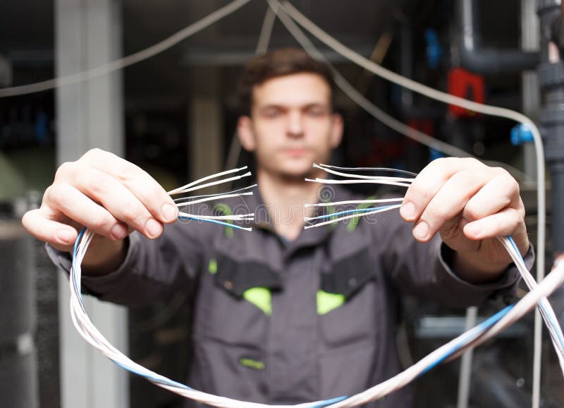 Hands of Young Electrician. Stock Image - Image of young, sleeve: 83254759