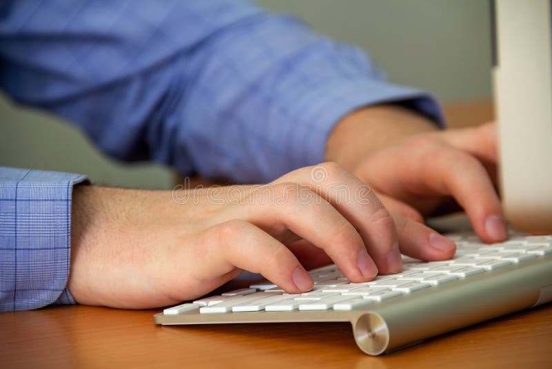 Hands of a Young Man on a Computer Keyboard Close-up, with Depth of ...