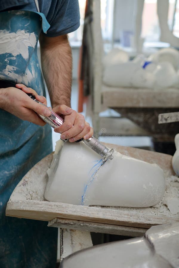Hands of Young Manufactory Worker Cutting Part of Plaster Cast Stock ...