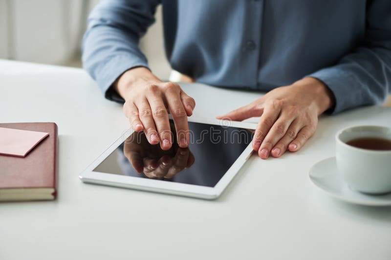 Hands of Young Woman Sitting by Desk and Scrolling through Online Posts ...