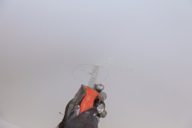 Handsaw Cutting Circular Hole in Ceiling Stock Image - Image of light ...