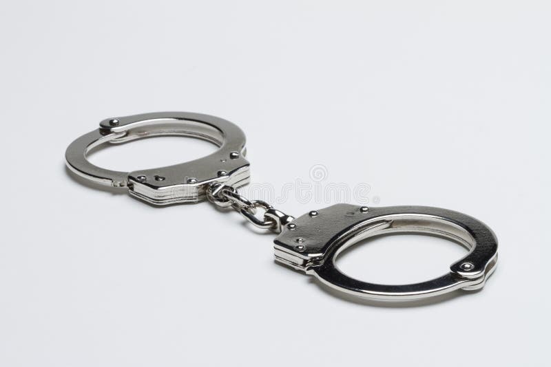 Handschellen Gegen Den Weißen Hintergrund, Horizontal Stockbild - Bild ...