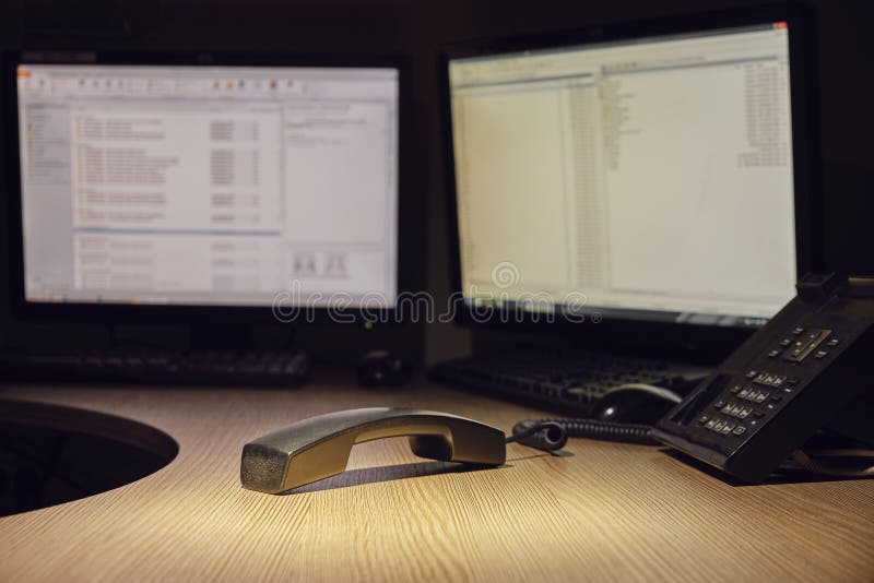 Landline Phone on Office Desk with Computer Monitors and Keyboards ...