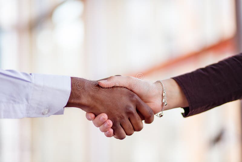Handshake between African and a Caucasian Man. Stock Image - Image of ...