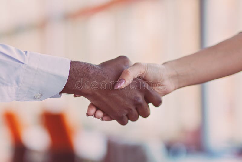 Handshake between African and a Caucasian Man. Stock Photo - Image of ...