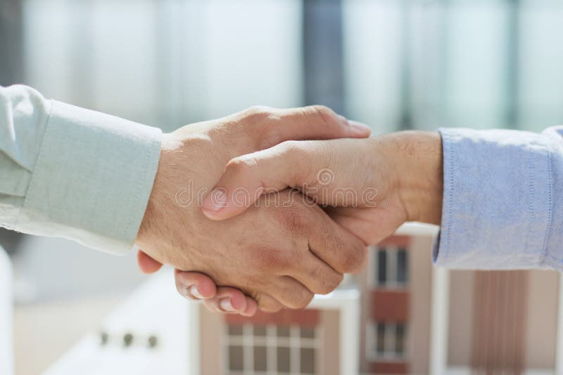 Handshake Against Background Model House Under Construction Client ...