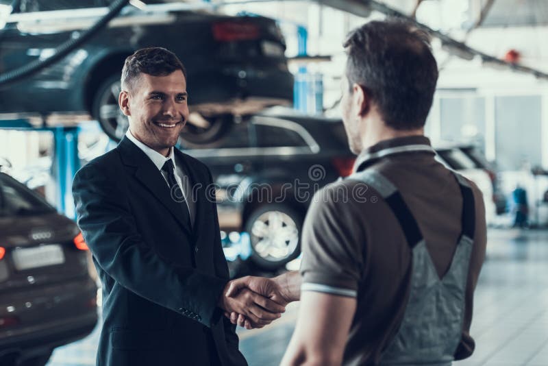 Handshake between Auto Mechanic and Client in Suit Stock Image - Image ...