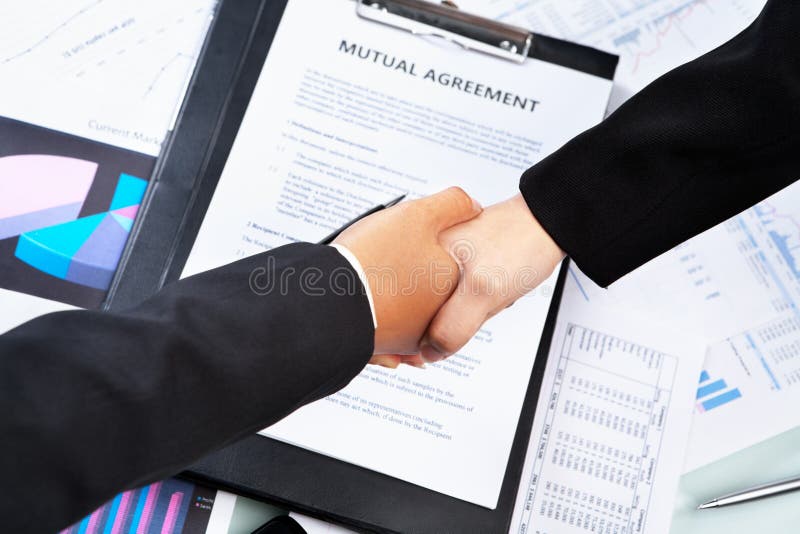Handshake Btween Businesswoman Over Agreement Stock Image - Image of ...