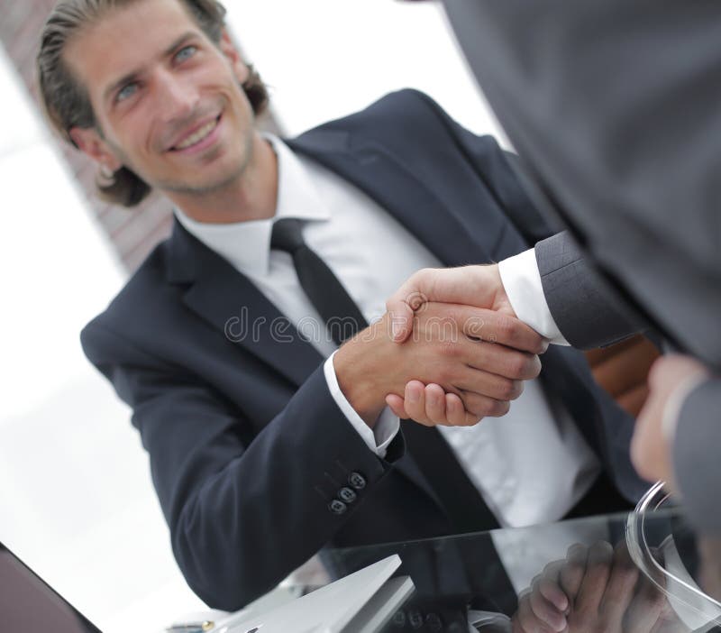 Handshake Business Partners in Front of the Open Laptop Stock Photo ... Handshake Business Partners in Front of the Open Laptop Stock Photo ...