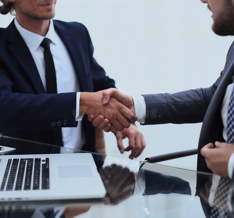 Handshake Business Partners in Front of the Open Laptop Stock Photo ... Handshake Business Partners in Front of the Open Laptop Stock Photo ...