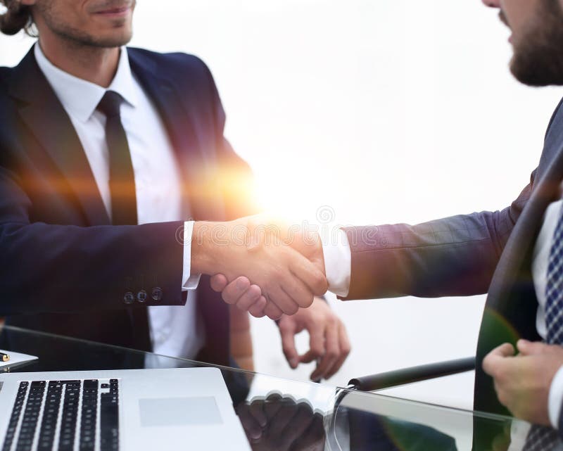 Handshake Business Partners in Front of the Open Laptop Stock Image ... Handshake Business Partners in Front of the Open Laptop Stock Image ...