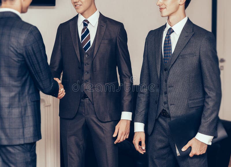 Handshake Business Partners in the Meeting Room of the Business Center ... Handshake Business Partners in the Meeting Room of the Business Center ...