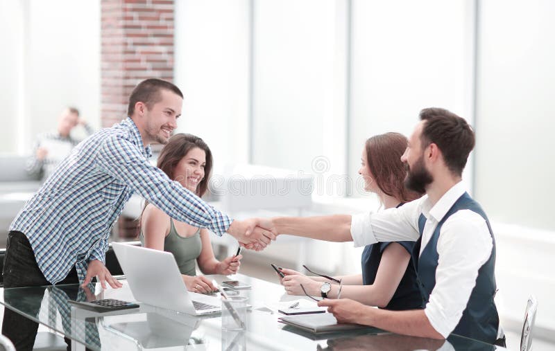 Handshake Business Partners Over the Desk in the Office Stock Image ...