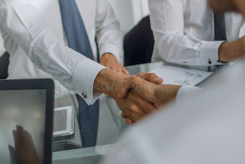 Handshake of Business People on a Work Desk. Stock Image - Image of ...