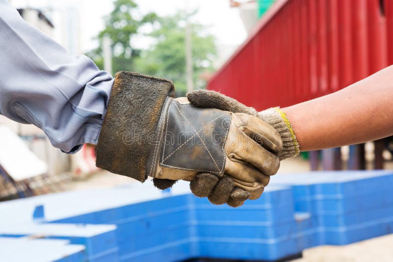Close Up of Builders Hands Making Handshake Stock Photo - Image of ...