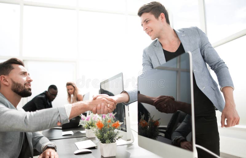 Handshake through computer stock photo. Image of hand - 4542818