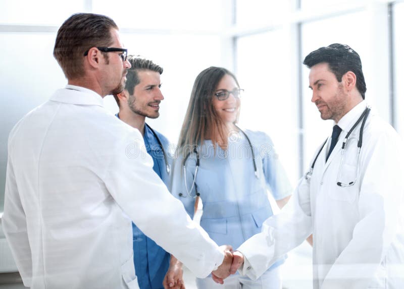 Handshake Colleagues in the Hospital Corridor Stock Image - Image of ...