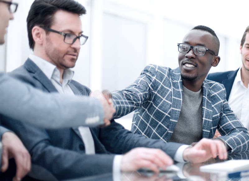 Handshake Colleagues Sitting at the Desk Stock Photo - Image of ...