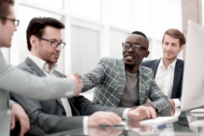 Handshake Colleagues Sitting at the Desk Stock Photo - Image of ...