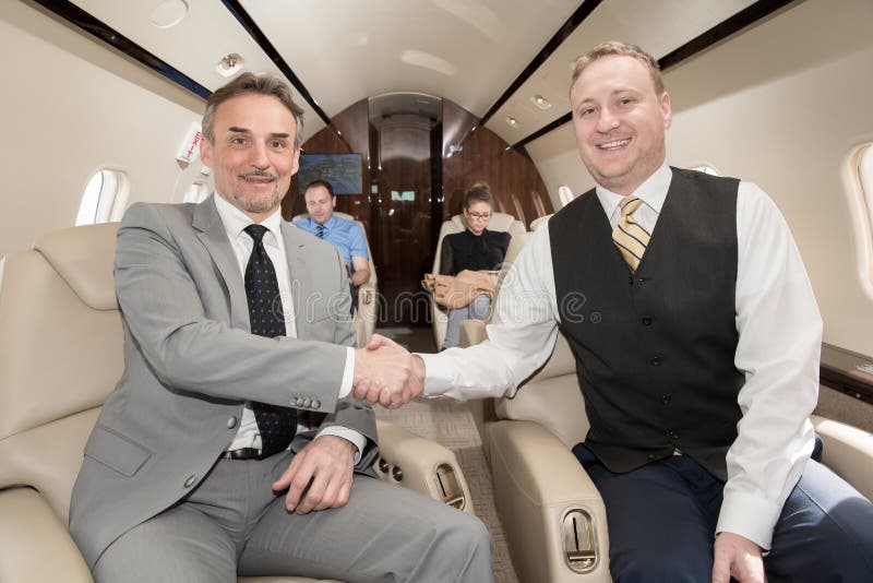 Handshake in Corporate Private Jet Stock Photo - Image of traveling ...