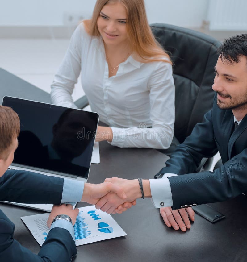Handshake Financial Partners Sitting at the Table Stock Image - Image ...