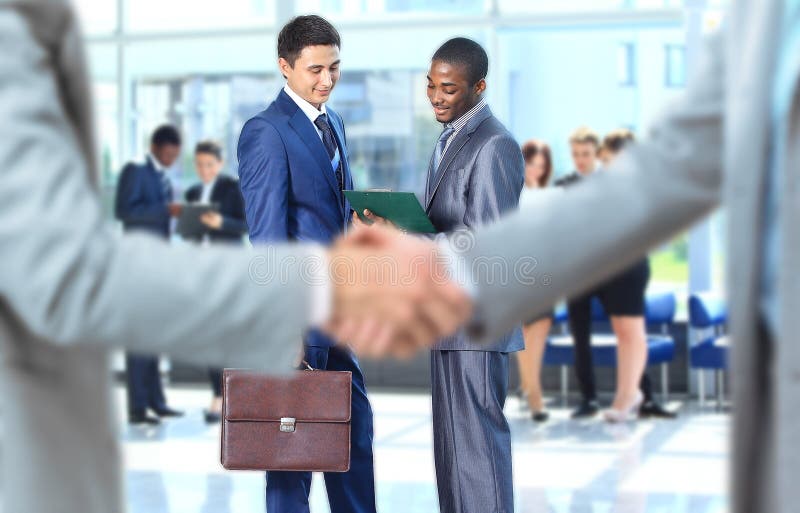 Handshake in Front of Business People Stock Image - Image of person ...