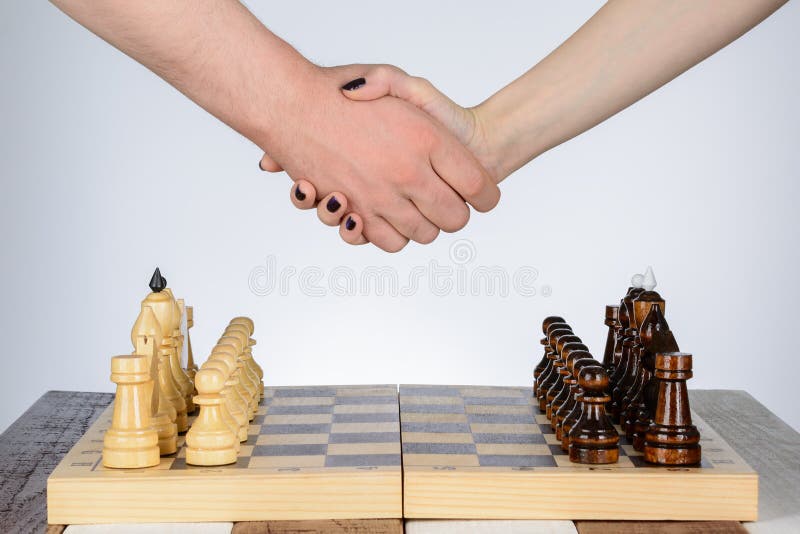 Handshake in Front a Game of Chess Stock Photo - Image of communication ...