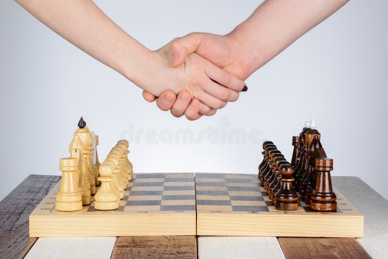 Handshake in Front a Game of Chess Stock Photo - Image of business ...