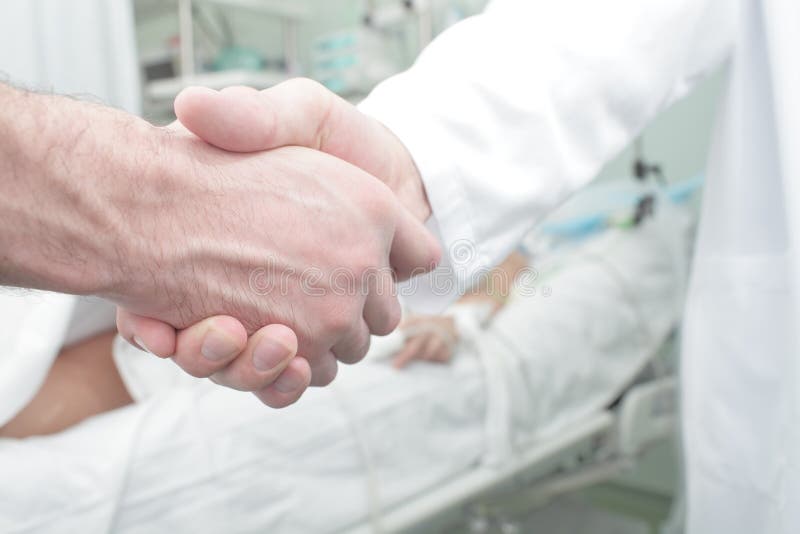 Handshake in Hospital Care and Assistance Concept Stock Photo - Image ...
