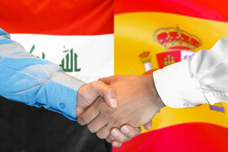 Handshake on Iraq and Spain Flag Background. Men Handshake on the ...