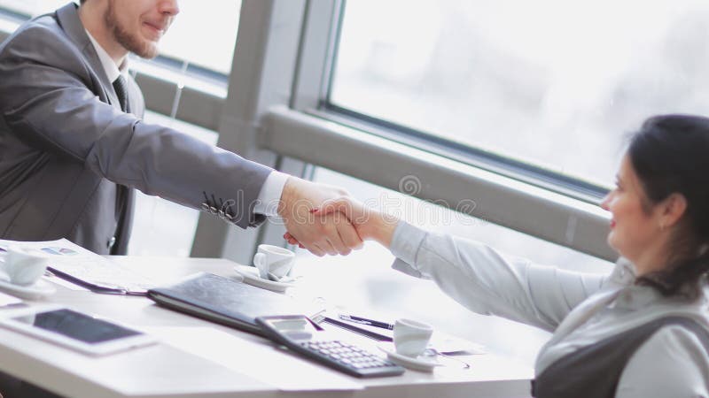 Handshake Manager and the Client Over a Desk Stock Photo - Image of ...