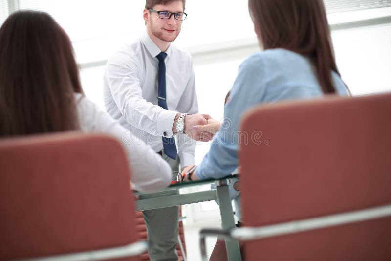 Handshake Manager and Client Over the Desk in the Office Stock Photo ...