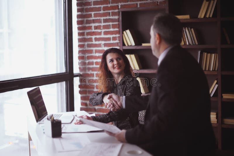 Handshake Manager and Client Sitting at Your Desk Stock Image - Image ...